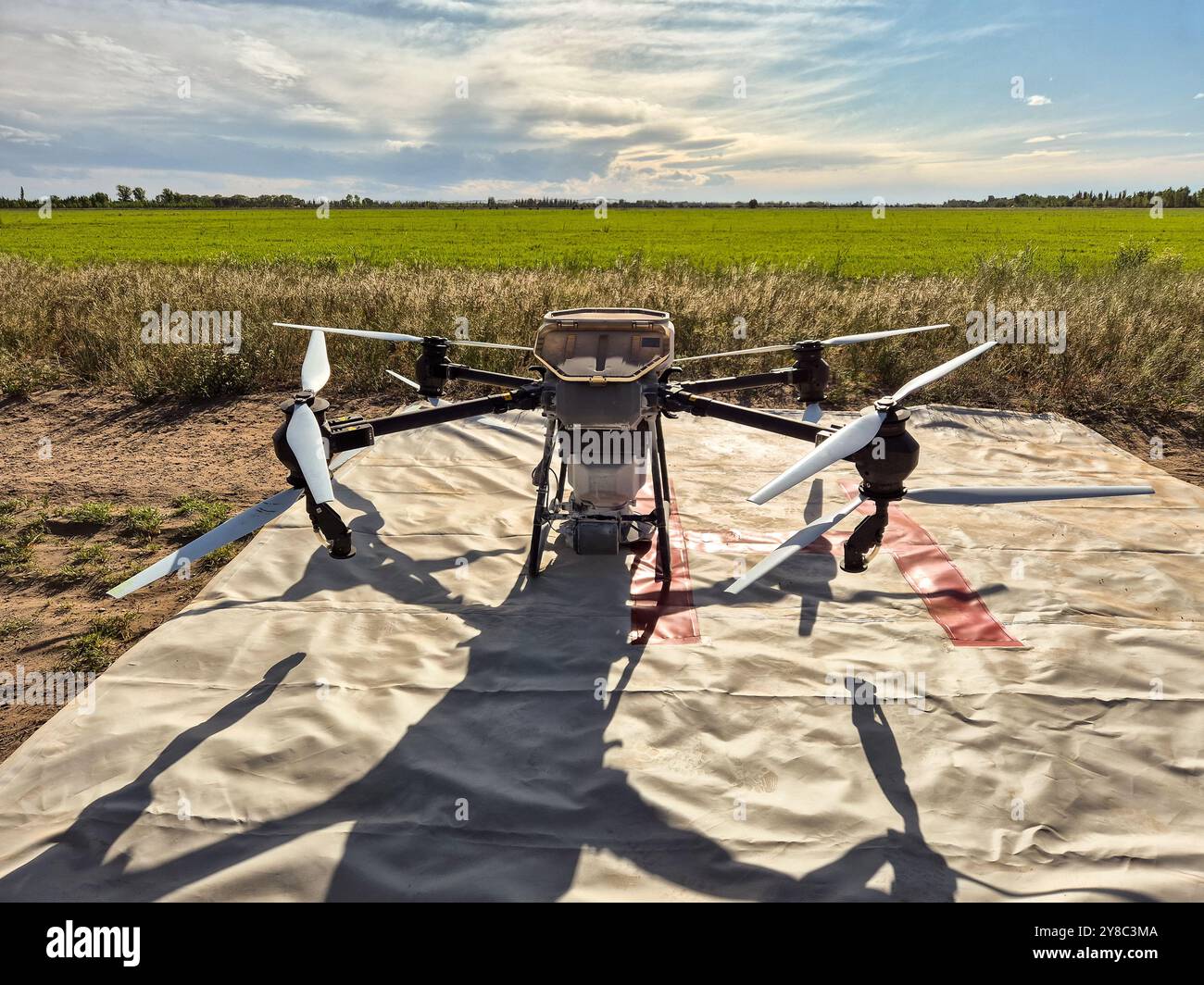 Large agricultural drone in flight, fertilizing a sown field Stock ...