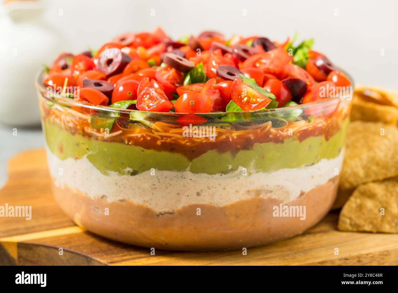 Homemade Mexican Seven Layer Dip with Tortilla Chips Stock Photo - Alamy
