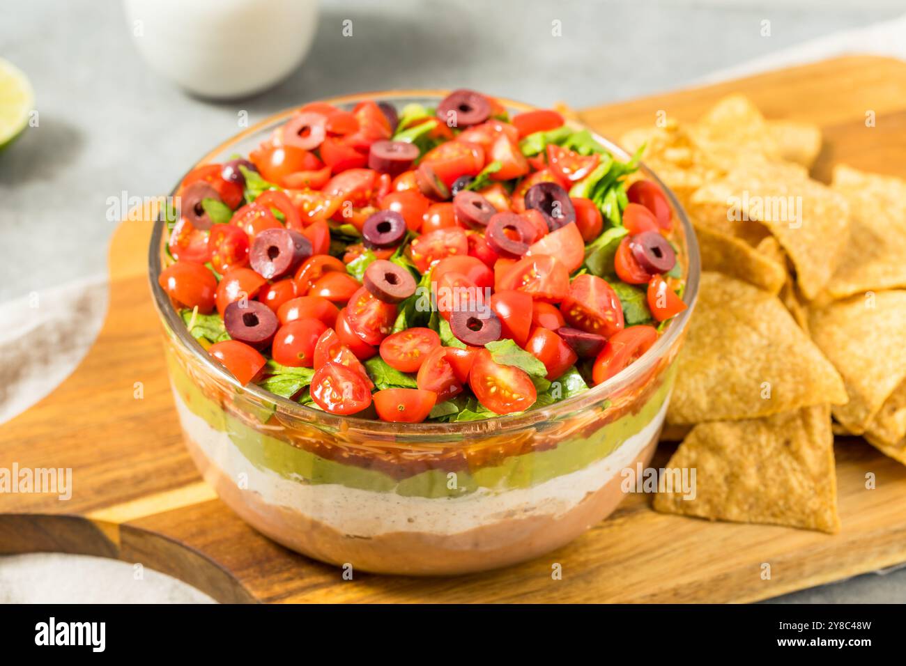 Homemade Mexican Seven Layer Dip with Tortilla Chips Stock Photo - Alamy