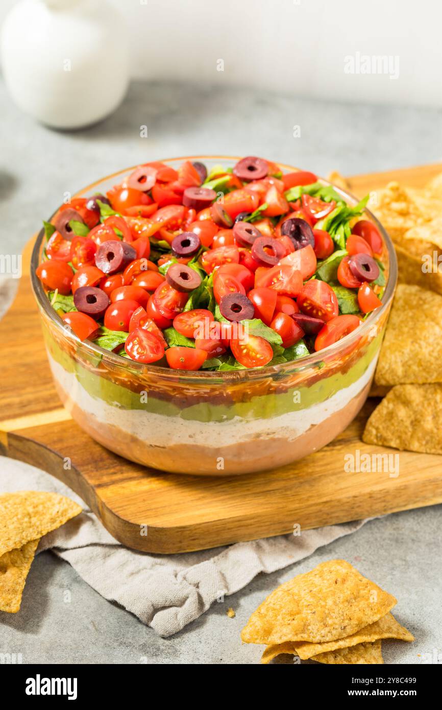 Homemade Mexican Seven Layer Dip with Tortilla Chips Stock Photo - Alamy