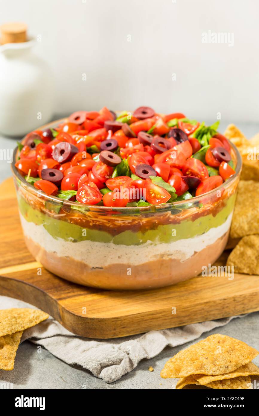 Homemade Mexican Seven Layer Dip with Tortilla Chips Stock Photo - Alamy