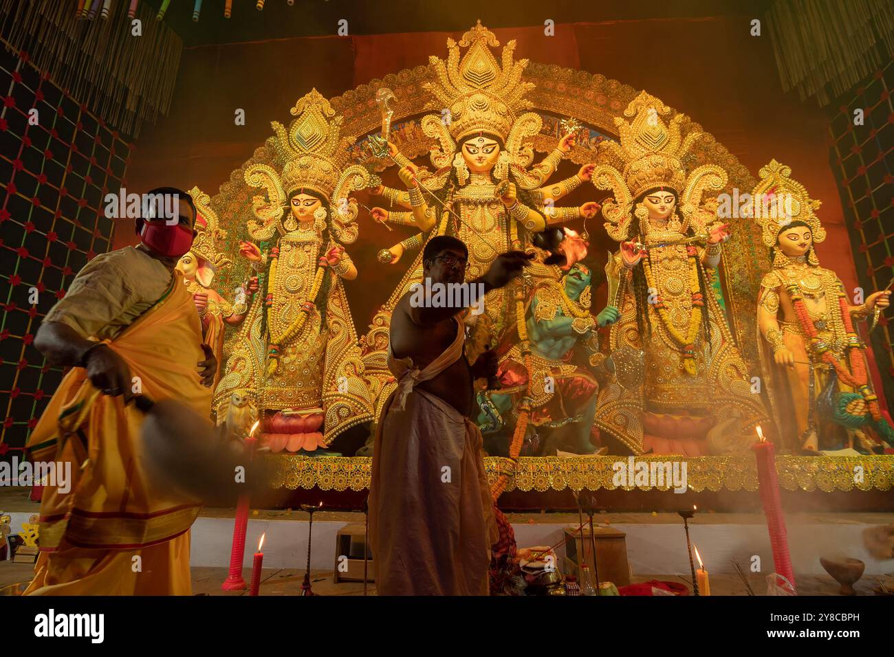 Howrah, West Bengal, India - 3rd October, 2022 : Hindu Priests worshipping Goddess Durga with ...