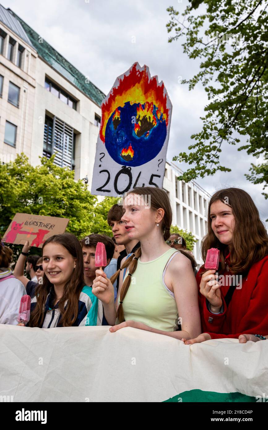 Berlin, Germany 31-5-2024 Young Crowd with melting Earth self-made sign ...