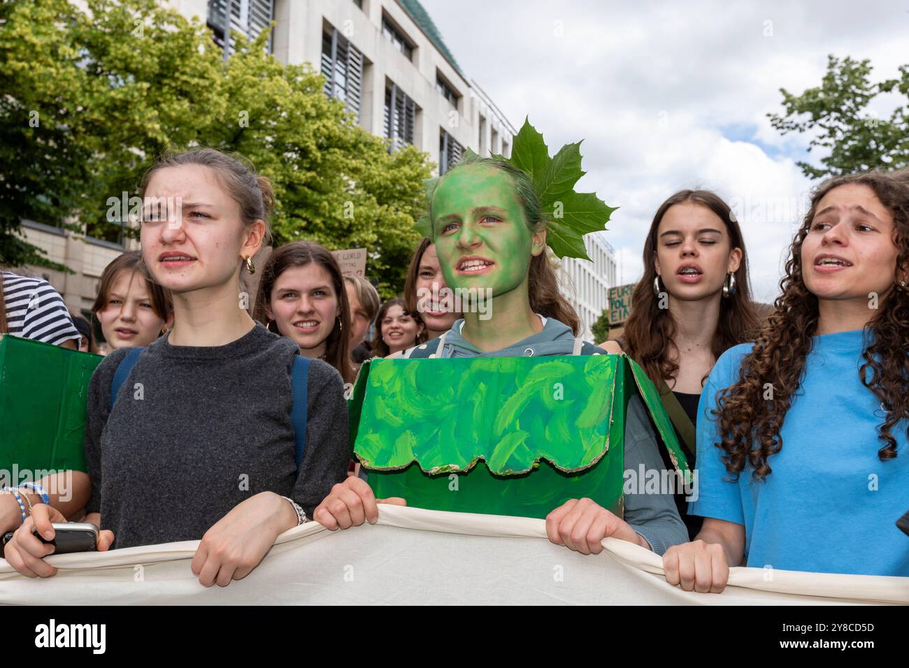 Berlin, Germany 31-5-2024 Young activist in green costume represents ...