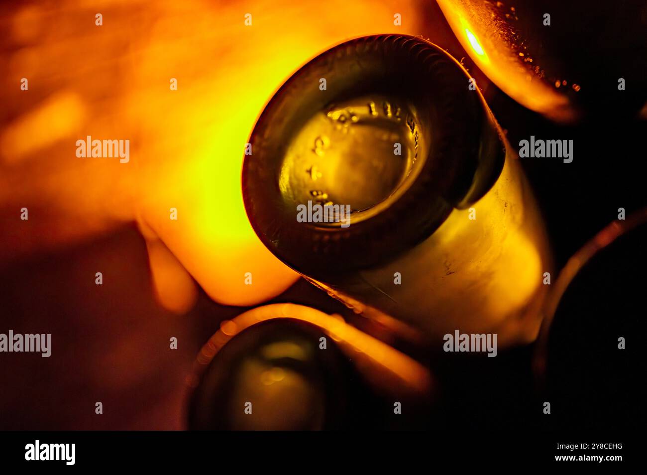 Champagne bottles on pupitre riddling racks in deep and long ...