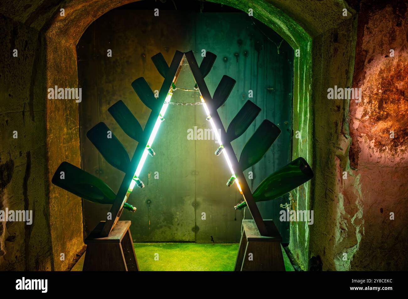 Champagne bottles on pupitre riddling racks in deep and long ...