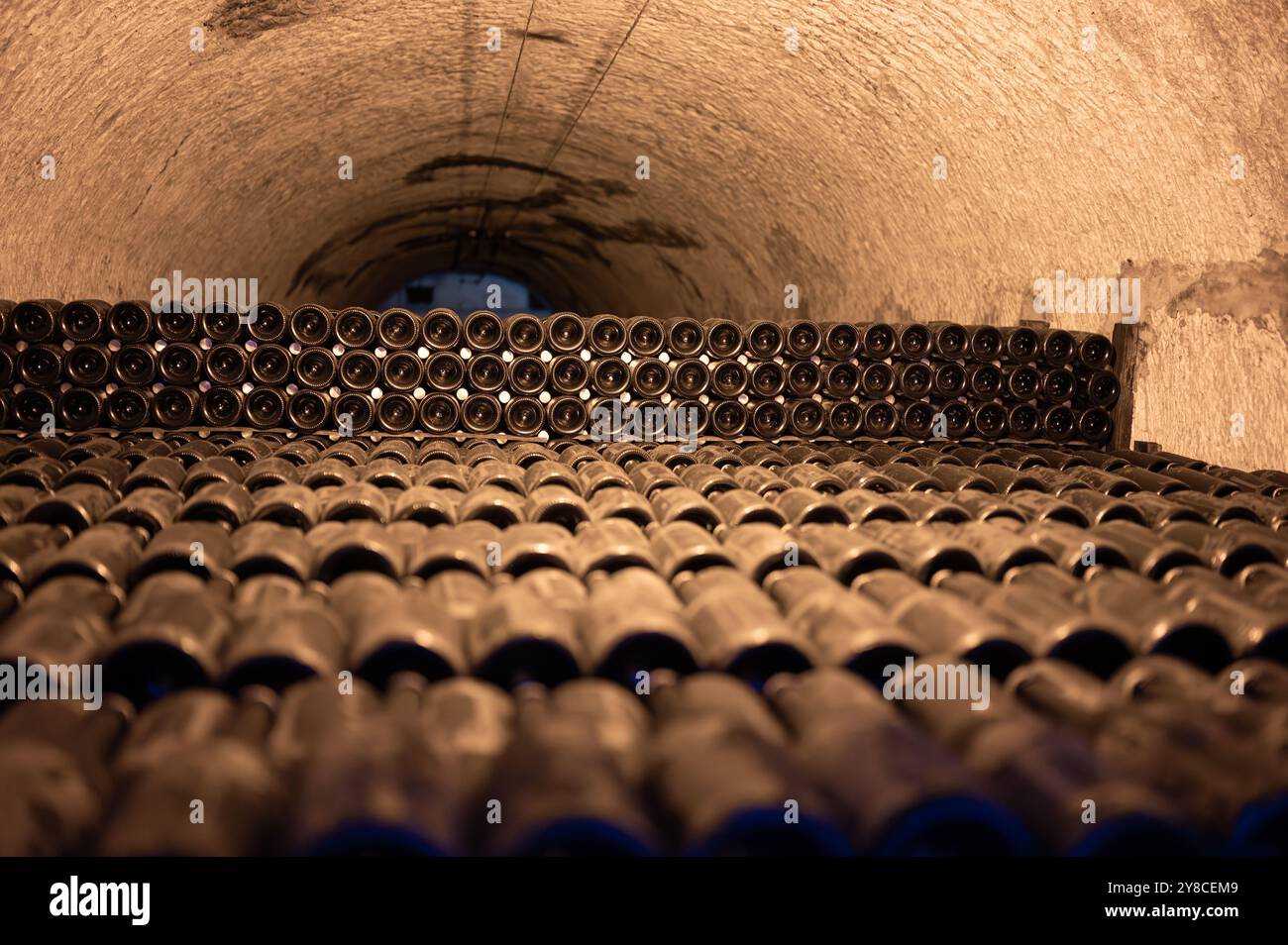 Visit of deep and long underground caves with dusty bottles on racks ...
