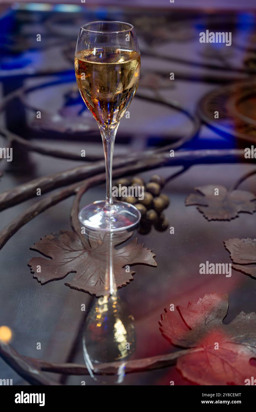 Tasting of brut and reserve grand cru champagne sparkling wine produced by traditional method in ...