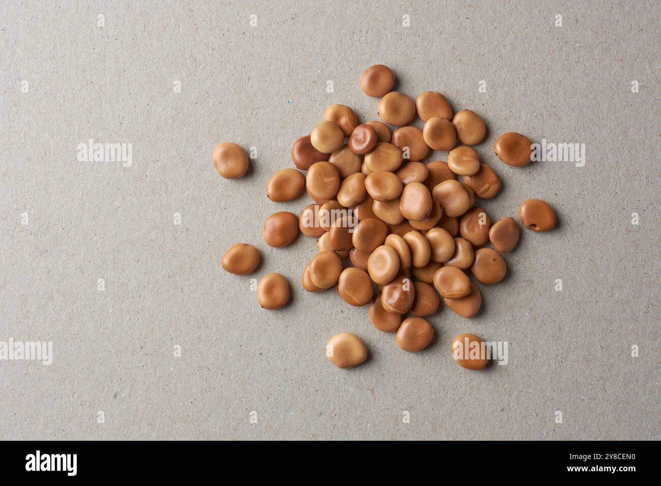 pile of pebble or velvet tamarind seeds isolated textured surface ...