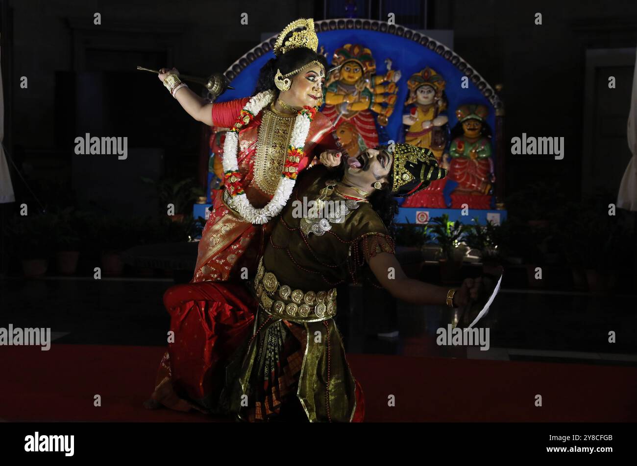 Dancers perform the ''Durgotsab'' dance dressed as goddess Durga and a ...
