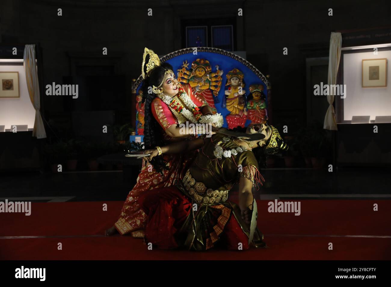 A performer performs the ''Durgotsab'' dance dressed as goddess Durga ...