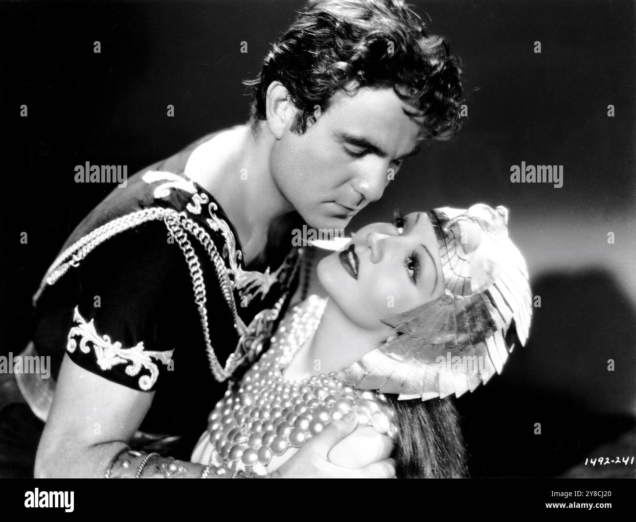 HENRY WILCOXON as Marc Antony and CLAUDETTE COLBERT in CLEOPATRA 1934 director CECIL B. DeMILLE ...