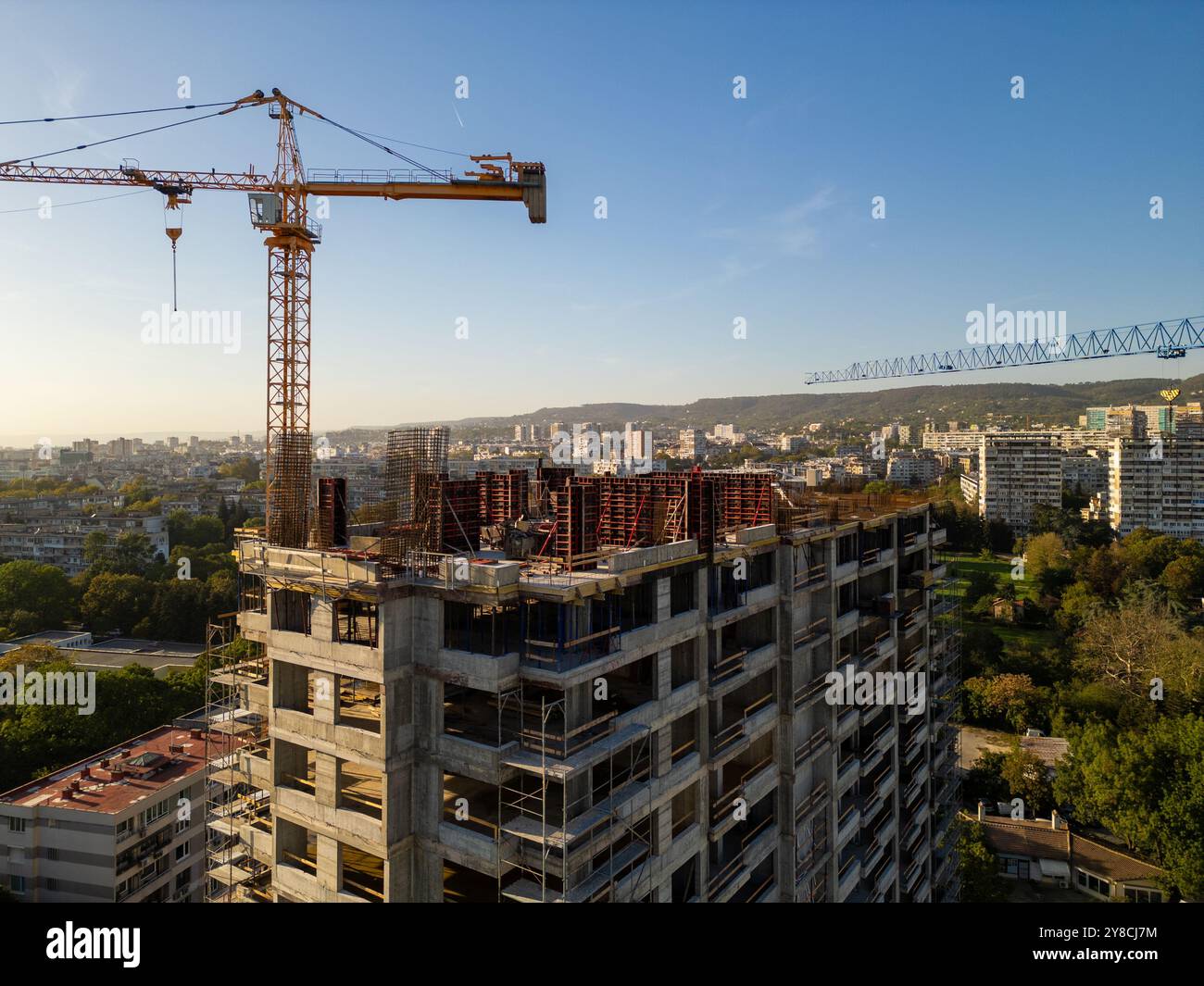 A drone video capturing the construction site of a high-rise building ...