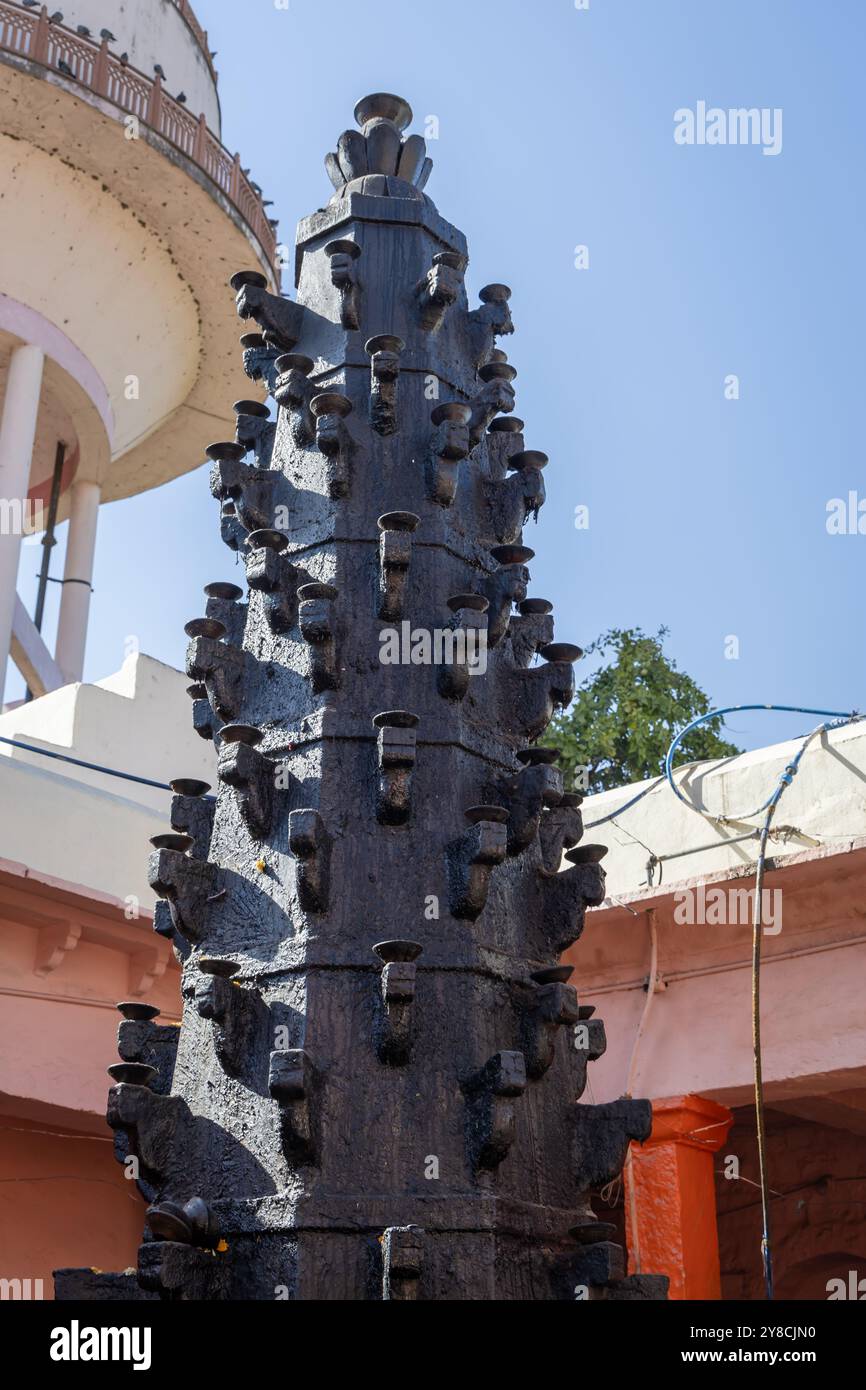 ancient south indian temple oil lamp holder at temple Stock Photo - Alamy
