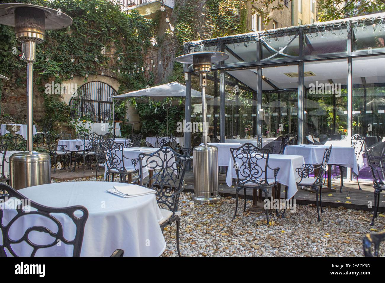Cozy outdoor restaurant in a green environment Stock Photo - Alamy