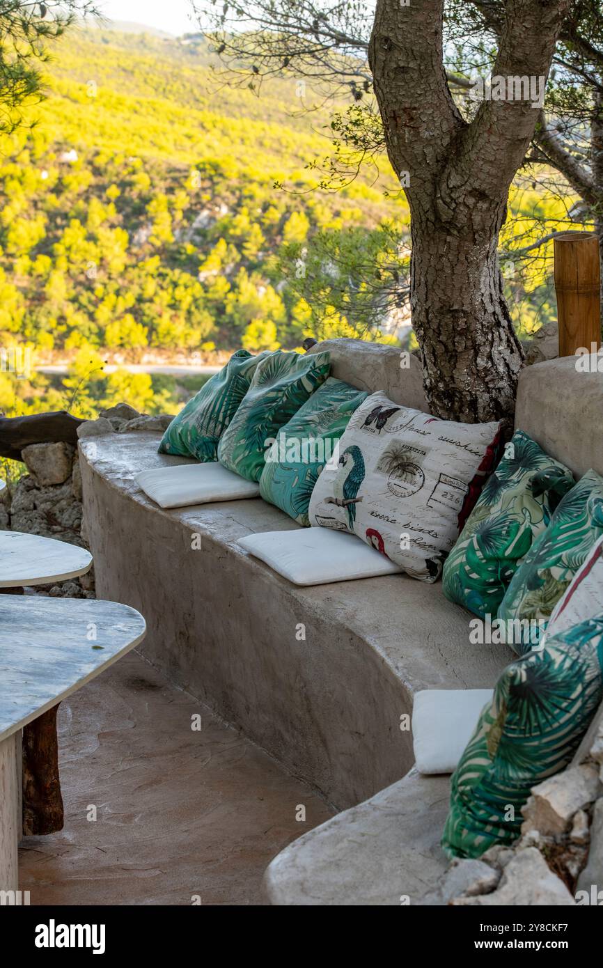 stone seating and bench at an upmarket Greek taverna on the island of ...