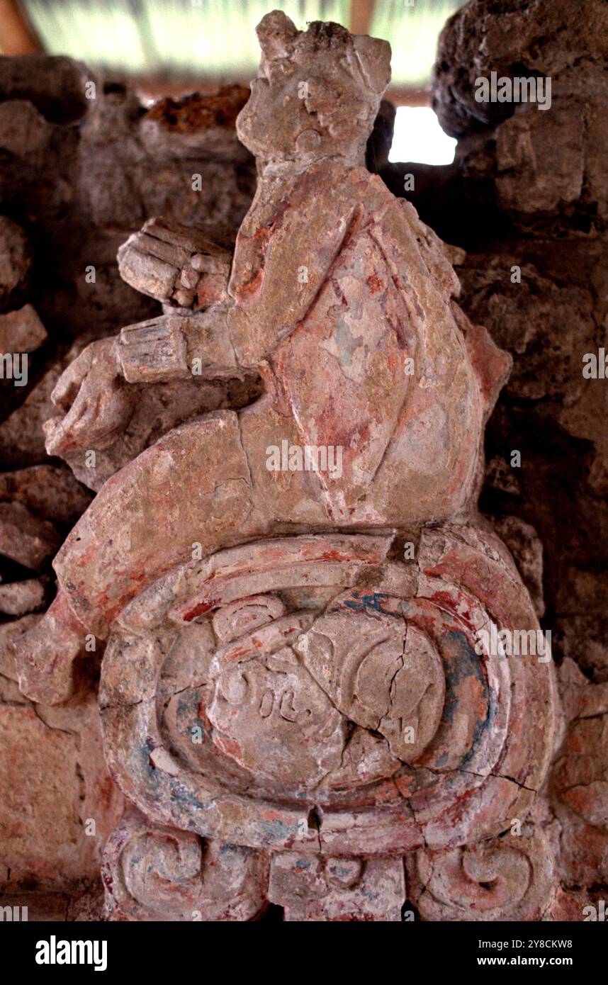 Red painted stucco Maya figure sitting on glyph, museum, Tonina Maya ...