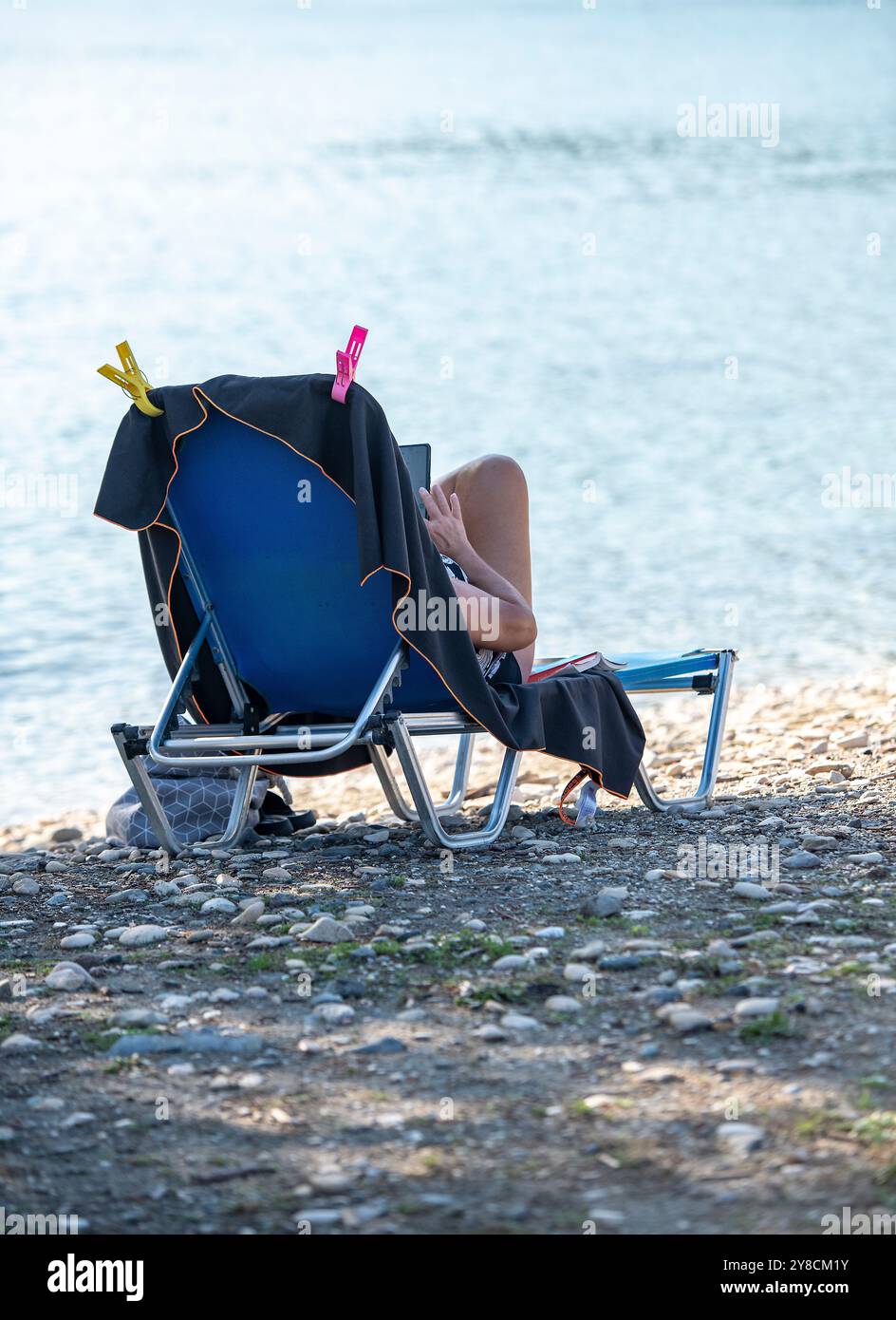 Book on face sun hi-res stock photography and images - Alamy