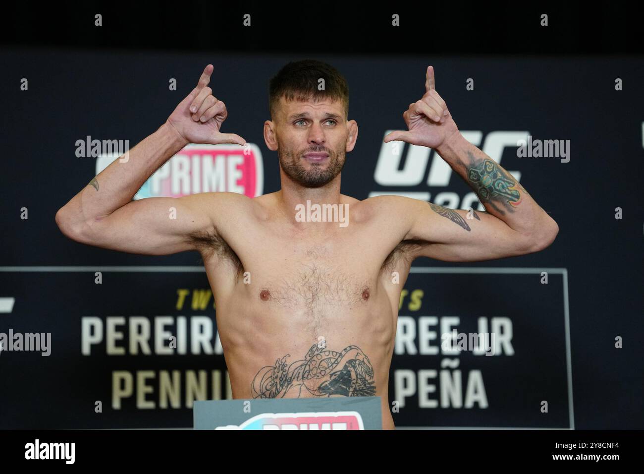 SALT LAKE CITY, UT - October 4: Tim Means steps on the scale for the ...