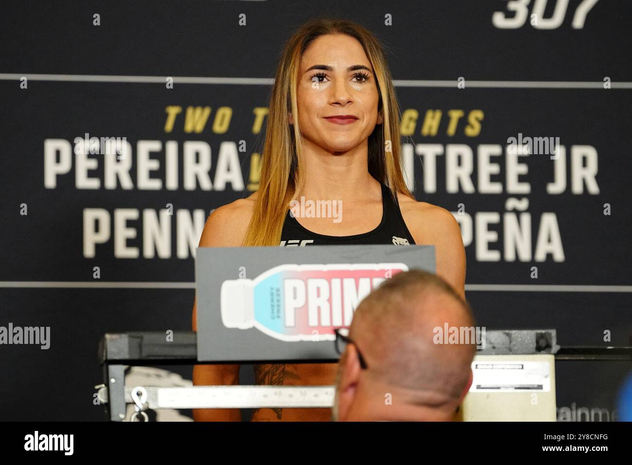 SALT LAKE CITY, UT - October 4: Tecia Pennington steps on the scale for ...
