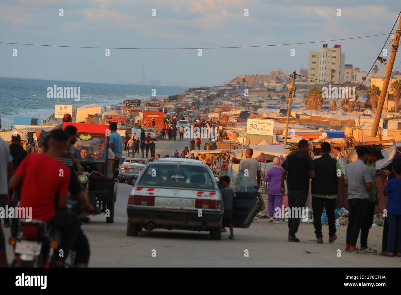 Tents are crammed together as displaced Palestinians camp on the beach ...