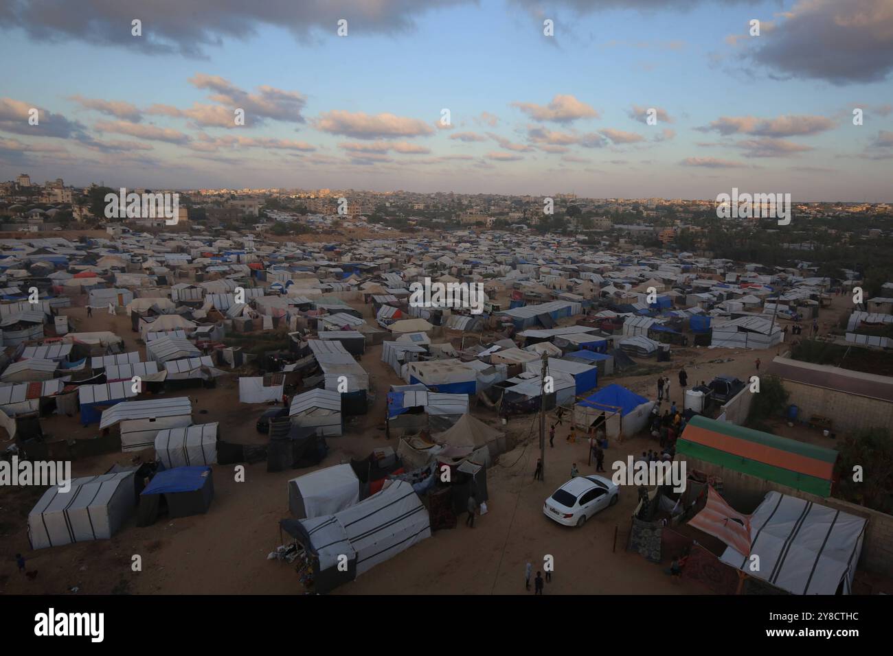 Tents are crammed together as displaced Palestinians camp on the beach ...