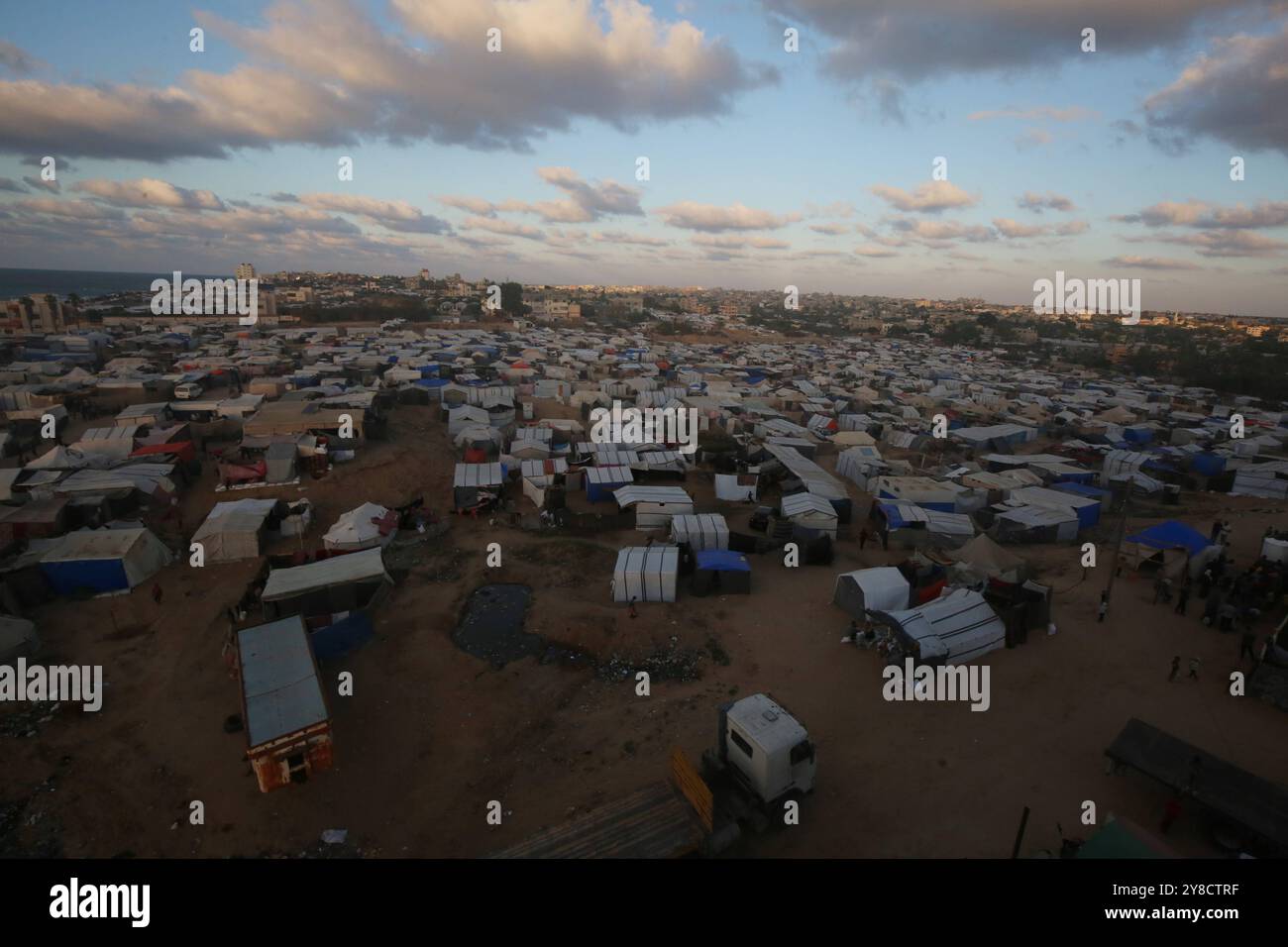 Tents are crammed together as displaced Palestinians camp on the beach ...