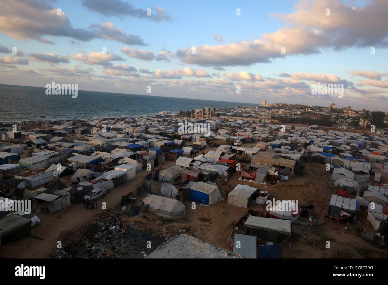 Tents are crammed together as displaced Palestinians camp on the beach ...