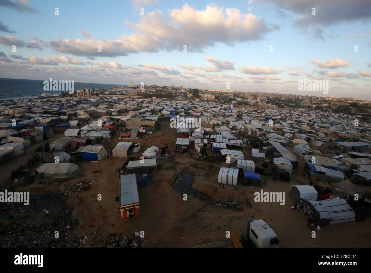 Tents are crammed together as displaced Palestinians camp on the beach ...