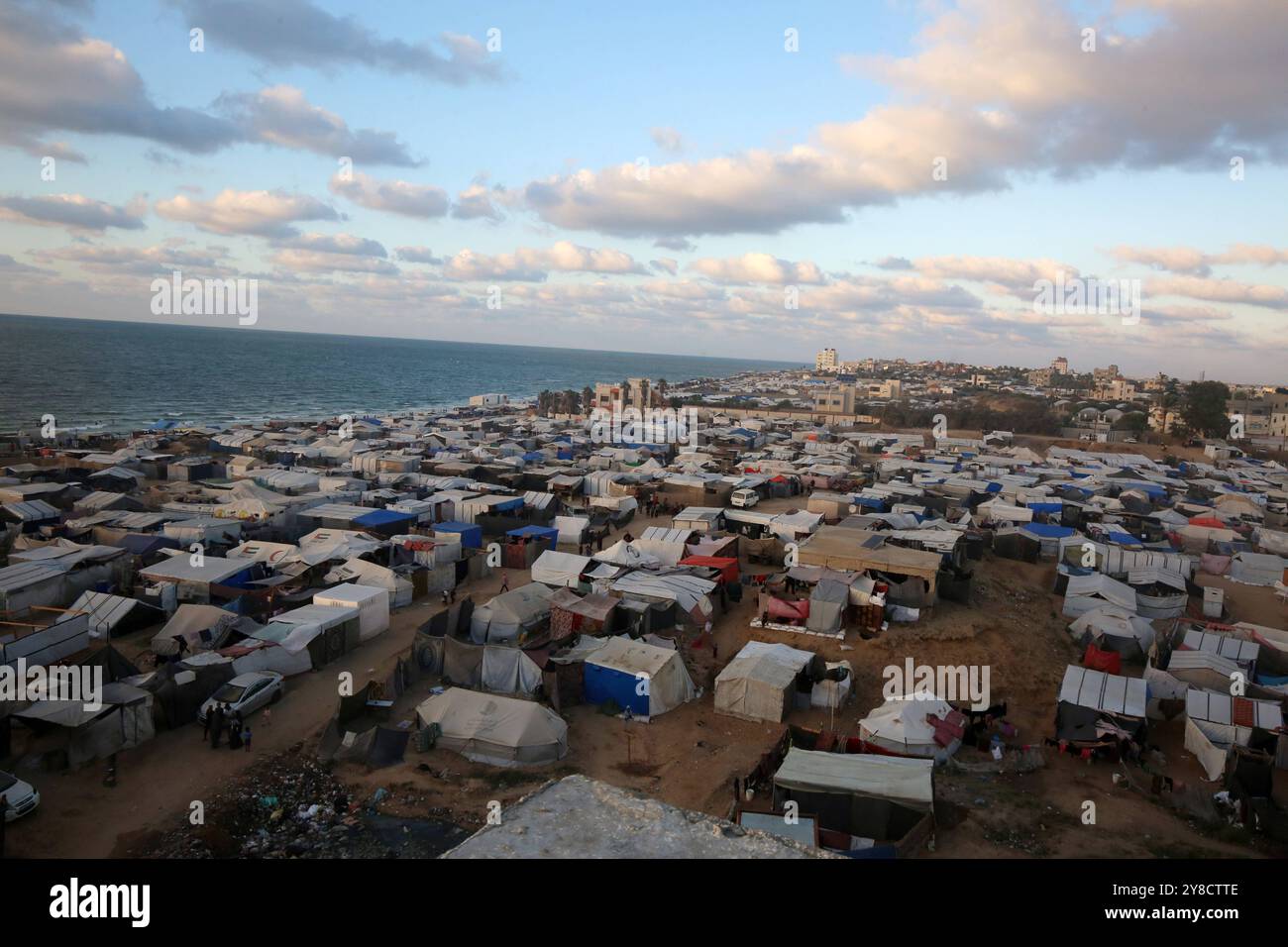 Tents are crammed together as displaced Palestinians camp on the beach ...