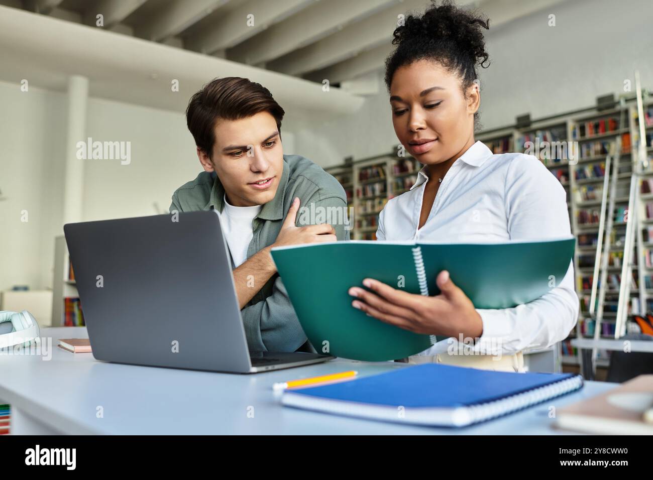 A dedicated educator assists her young student with important study concepts in a lively ...