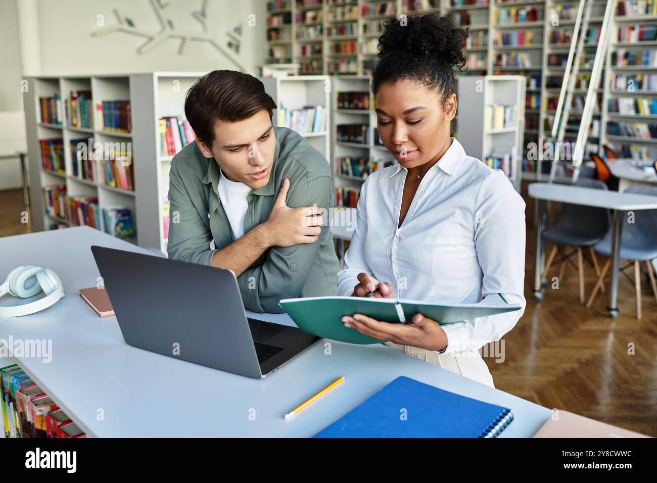 A teacher guides her student through a learning experience, promoting ...