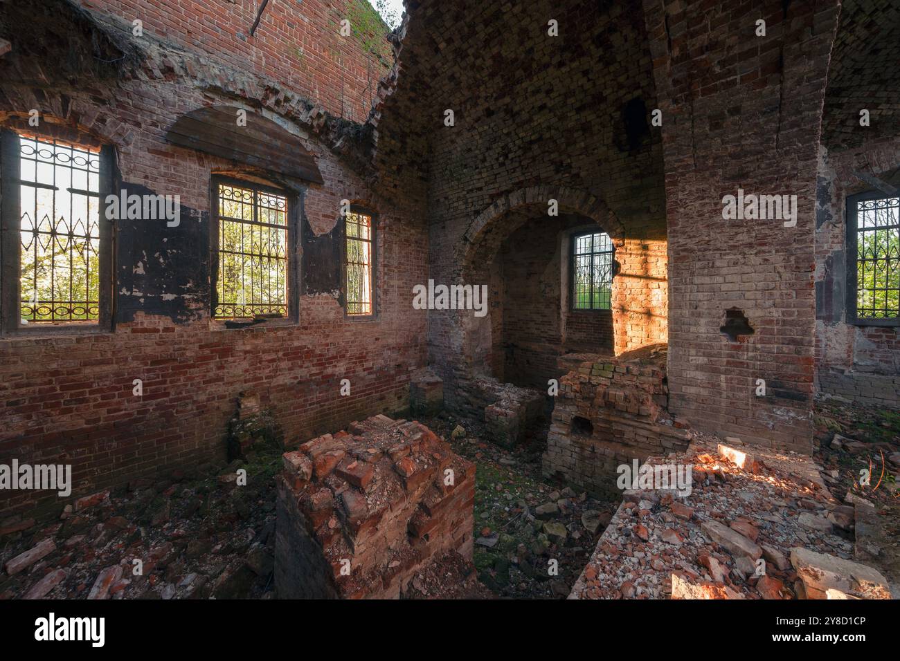 Brick ruins of an abandoned church with iron bars on the windows Stock ...
