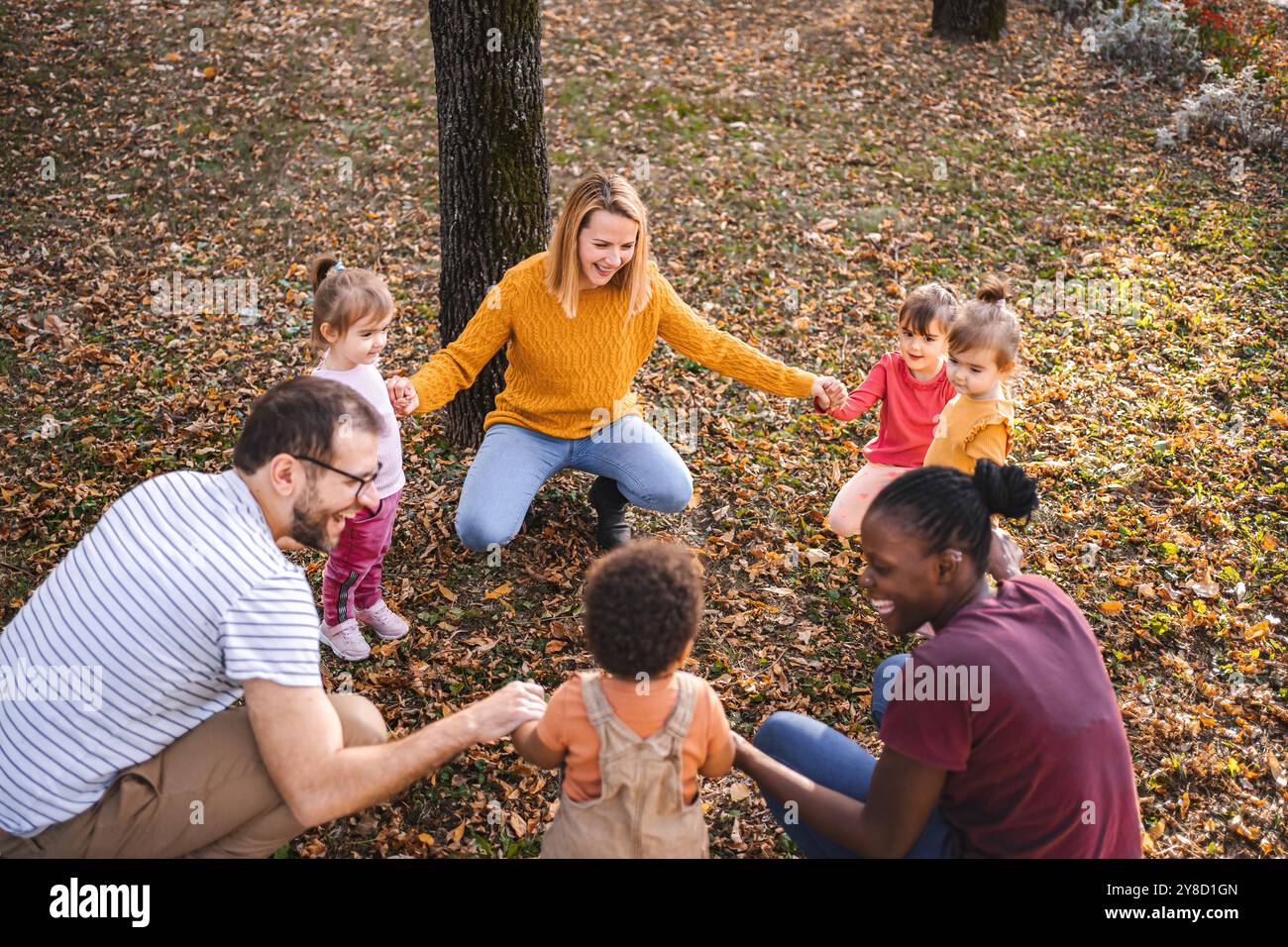 Circle of Fun: Family and Friends Enjoying Autumn Together Stock Photo ...