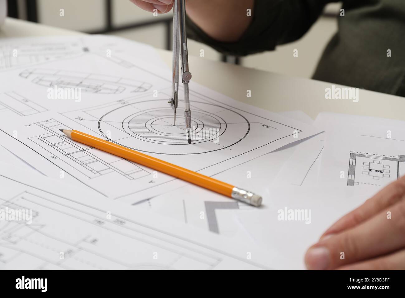 Engineer working with project, closeup. Different technical drawings on white table Stock Photo ...