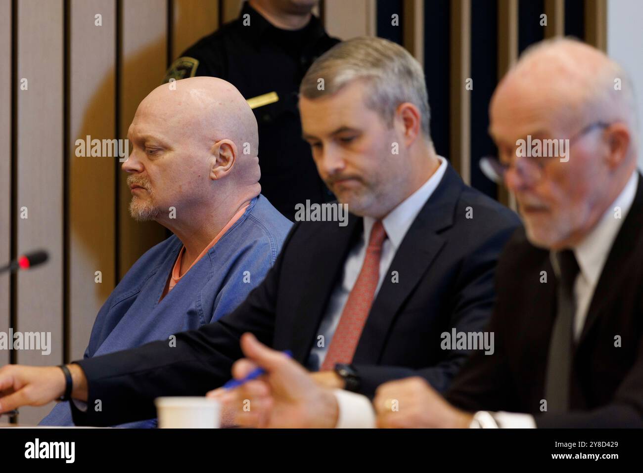 Portland, USA. 03rd Oct, 2024. Robert Plympton sits next to defense ...