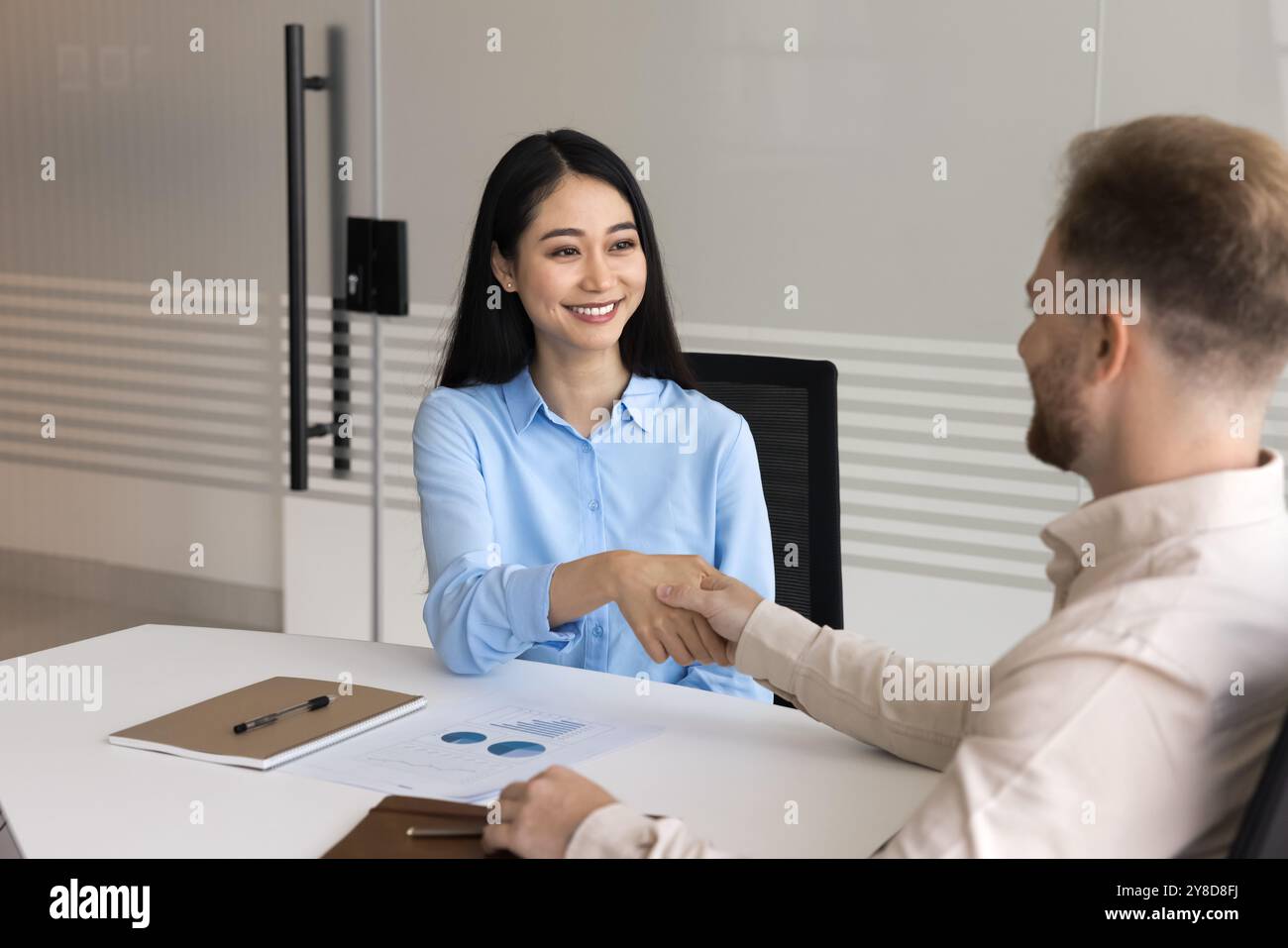 Positive diverse male and female business leaders shaking hands Stock ...