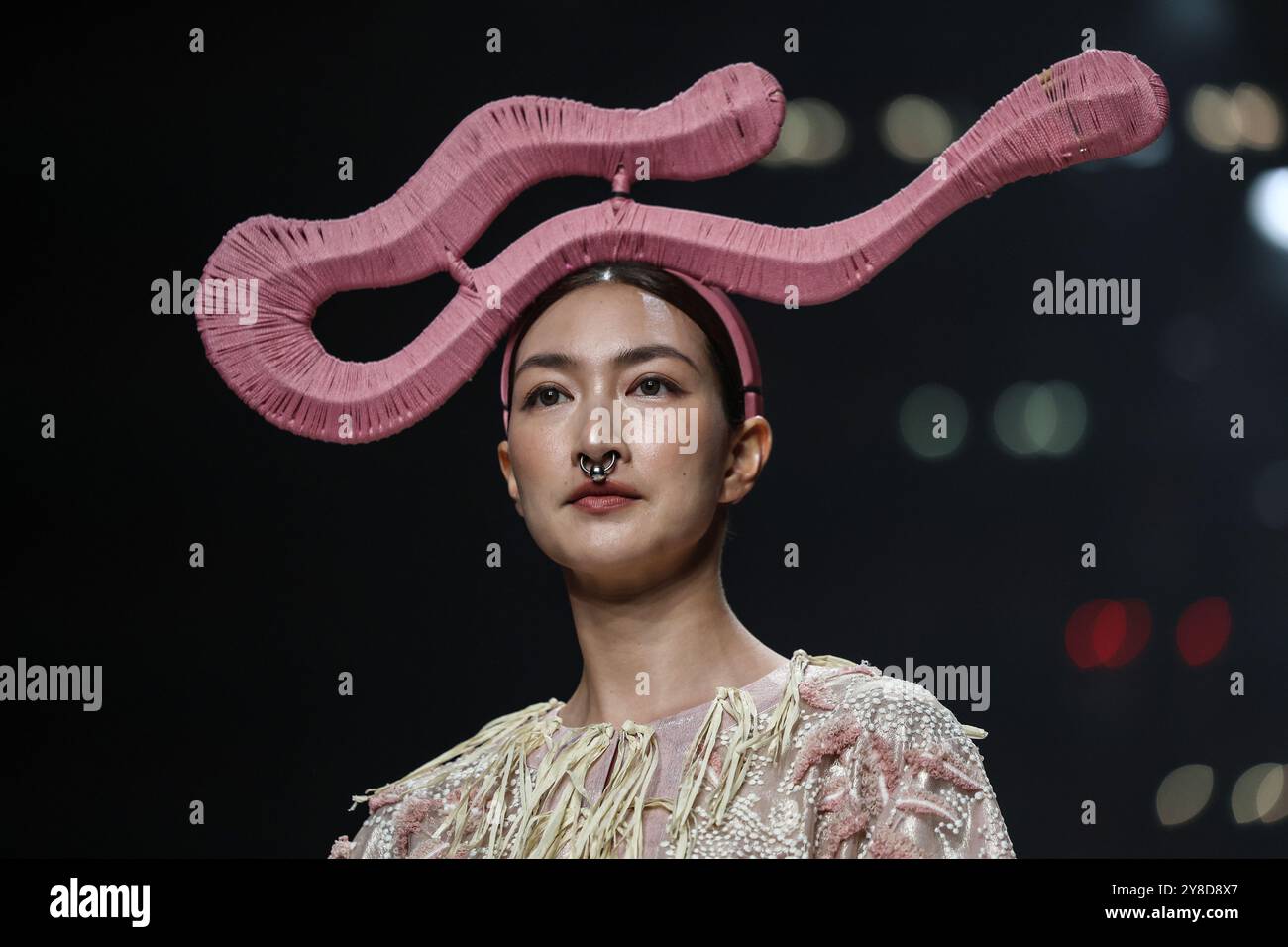 Bangkok, Thailand. 4th Oct, 2024. A model presents a creation from ...