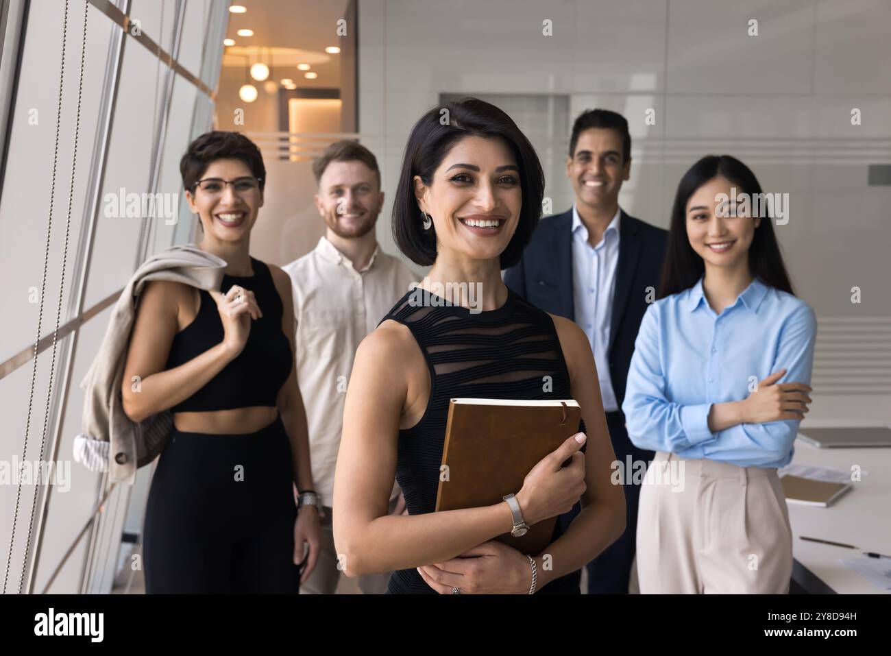 Happy successful young project leader woman posing with for portrait ...