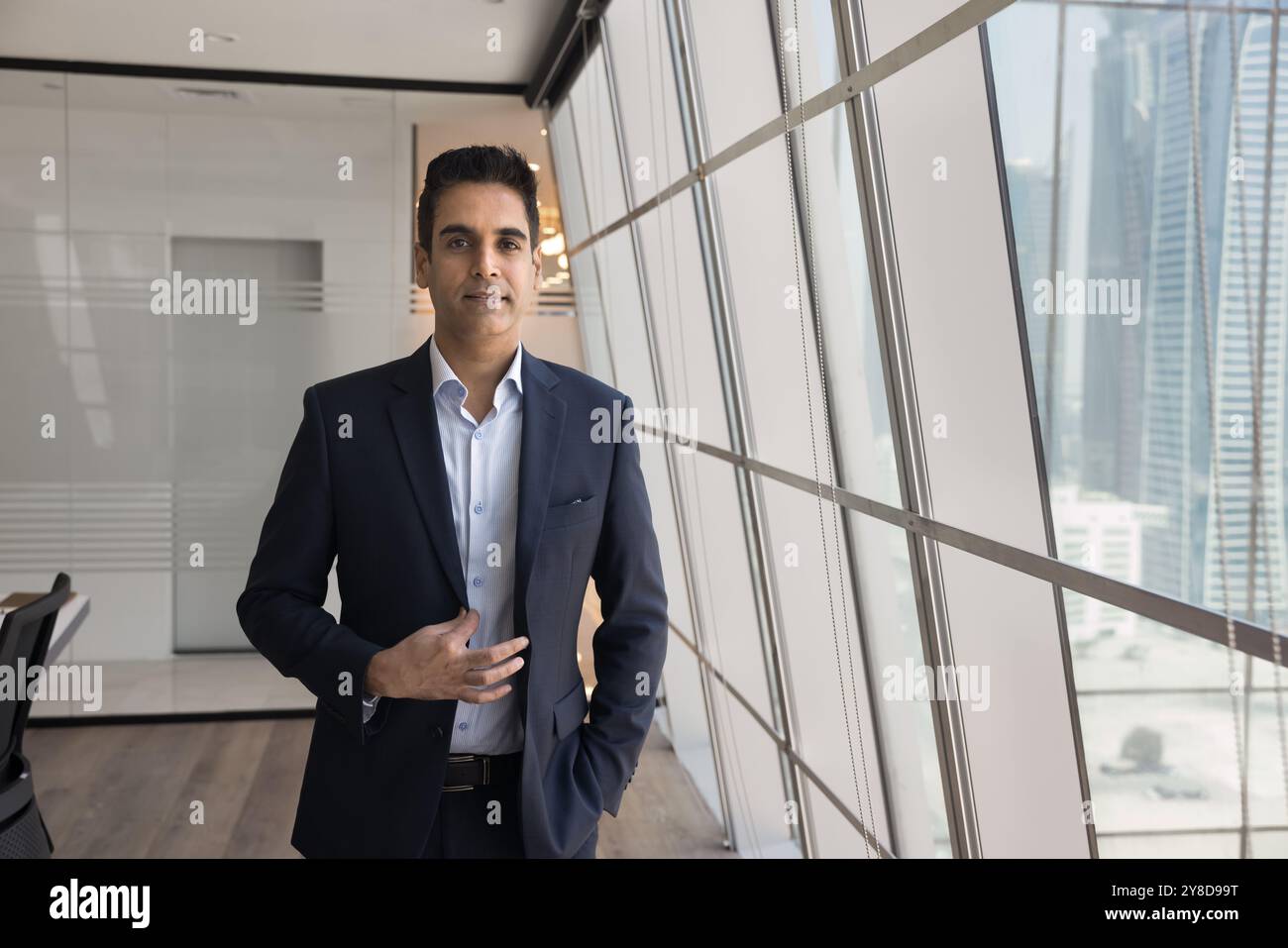 Handsome confident Indian CEO man posing for business portrait Stock ...