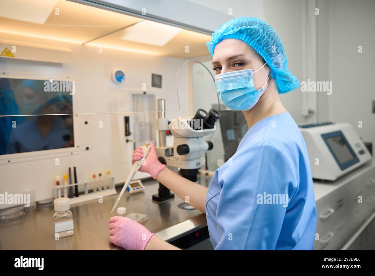 Embryologist working under sterile conditions in the lab Stock Photo ...