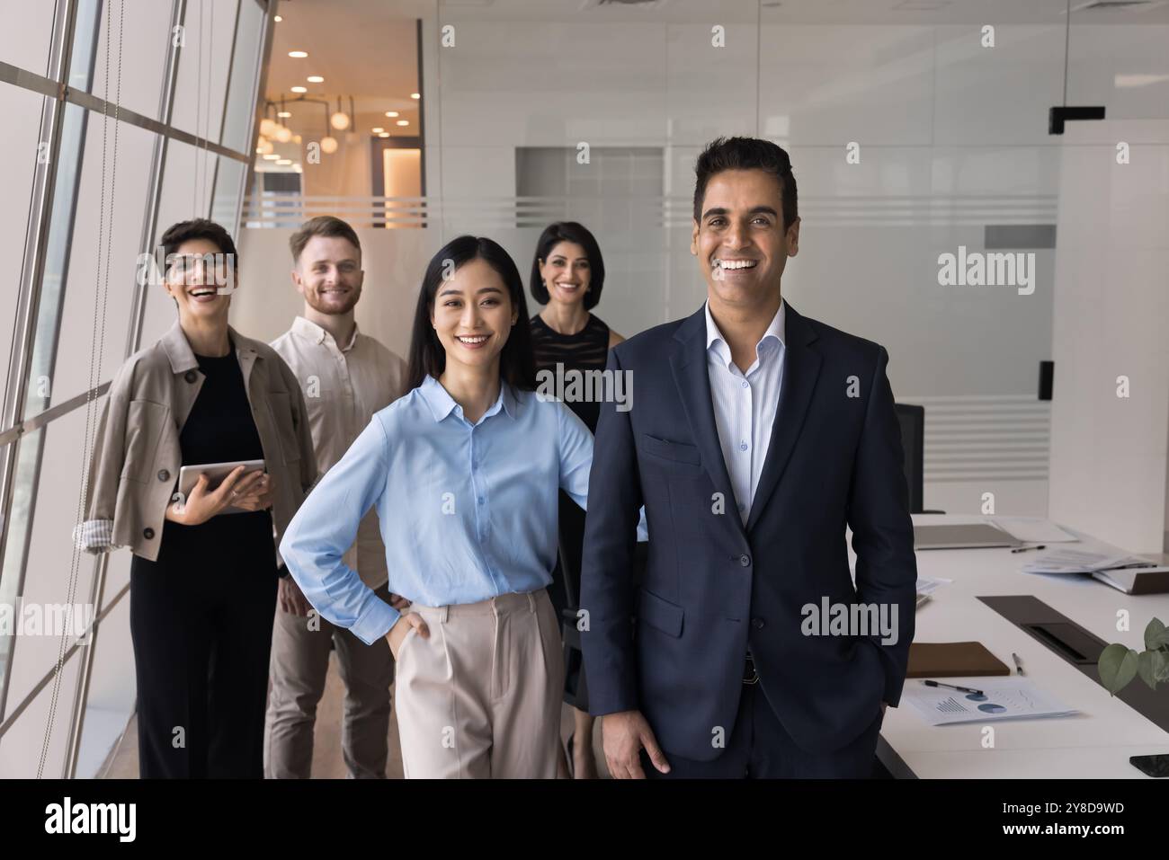 Happy Indian company leader man standing in front of team Stock Photo ...