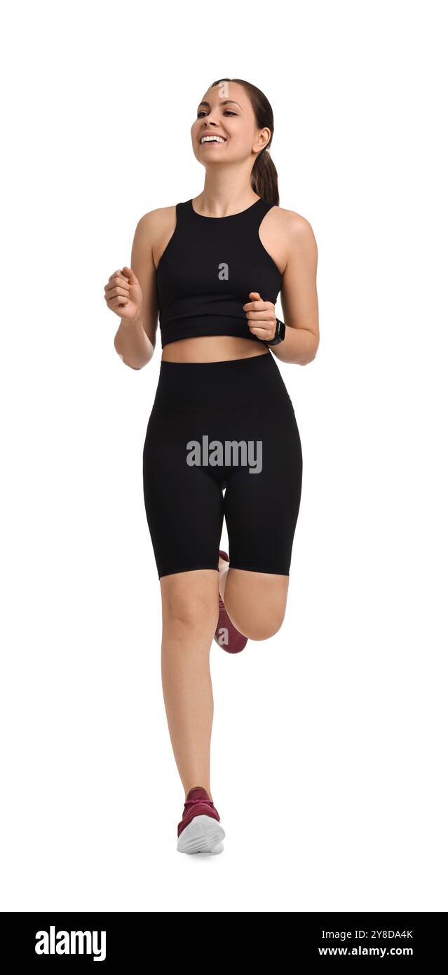 Smiling athletic woman running on white background Stock Photo - Alamy