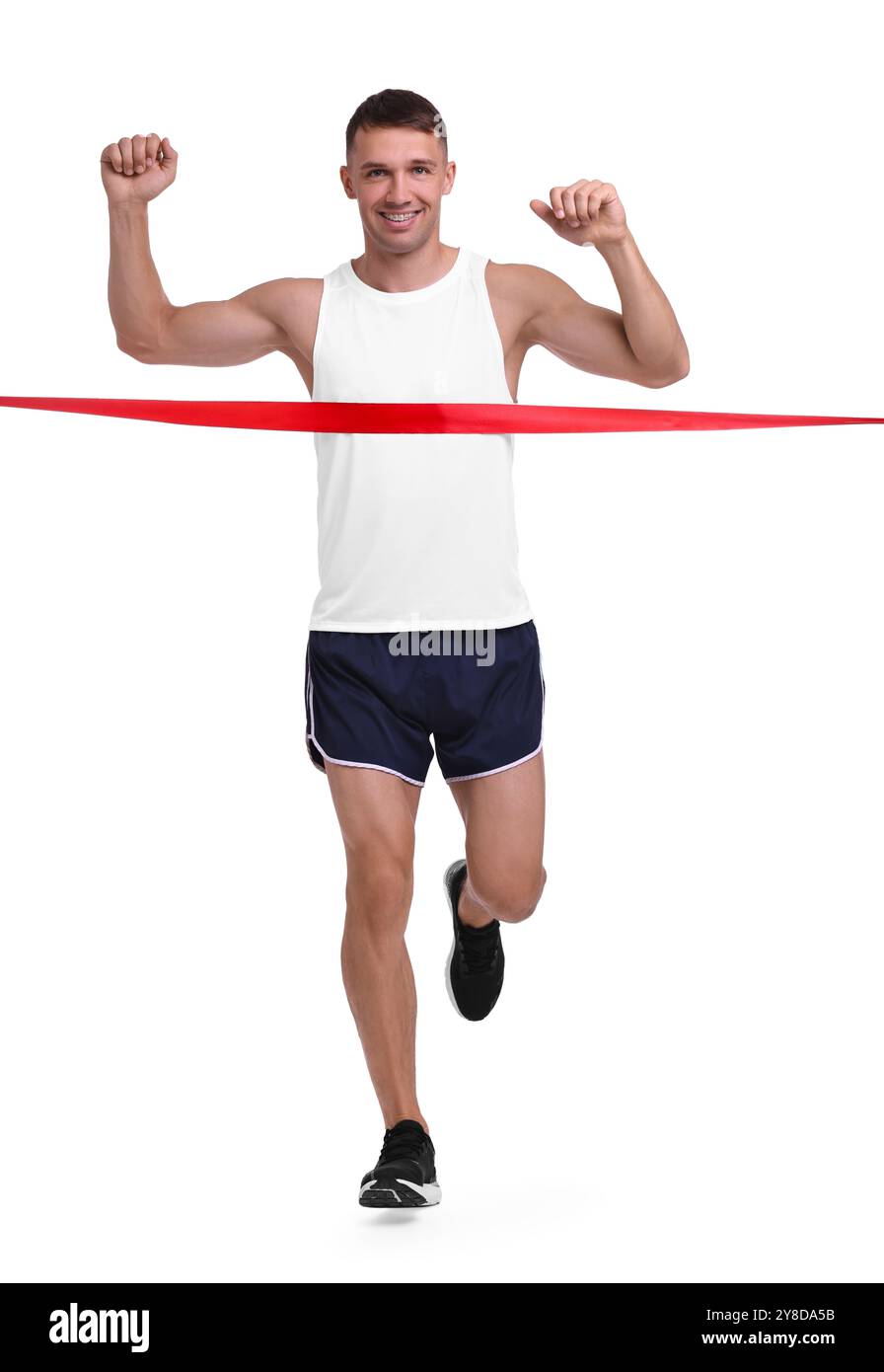 Man in sportswear crossing red finish line on white background Stock ...