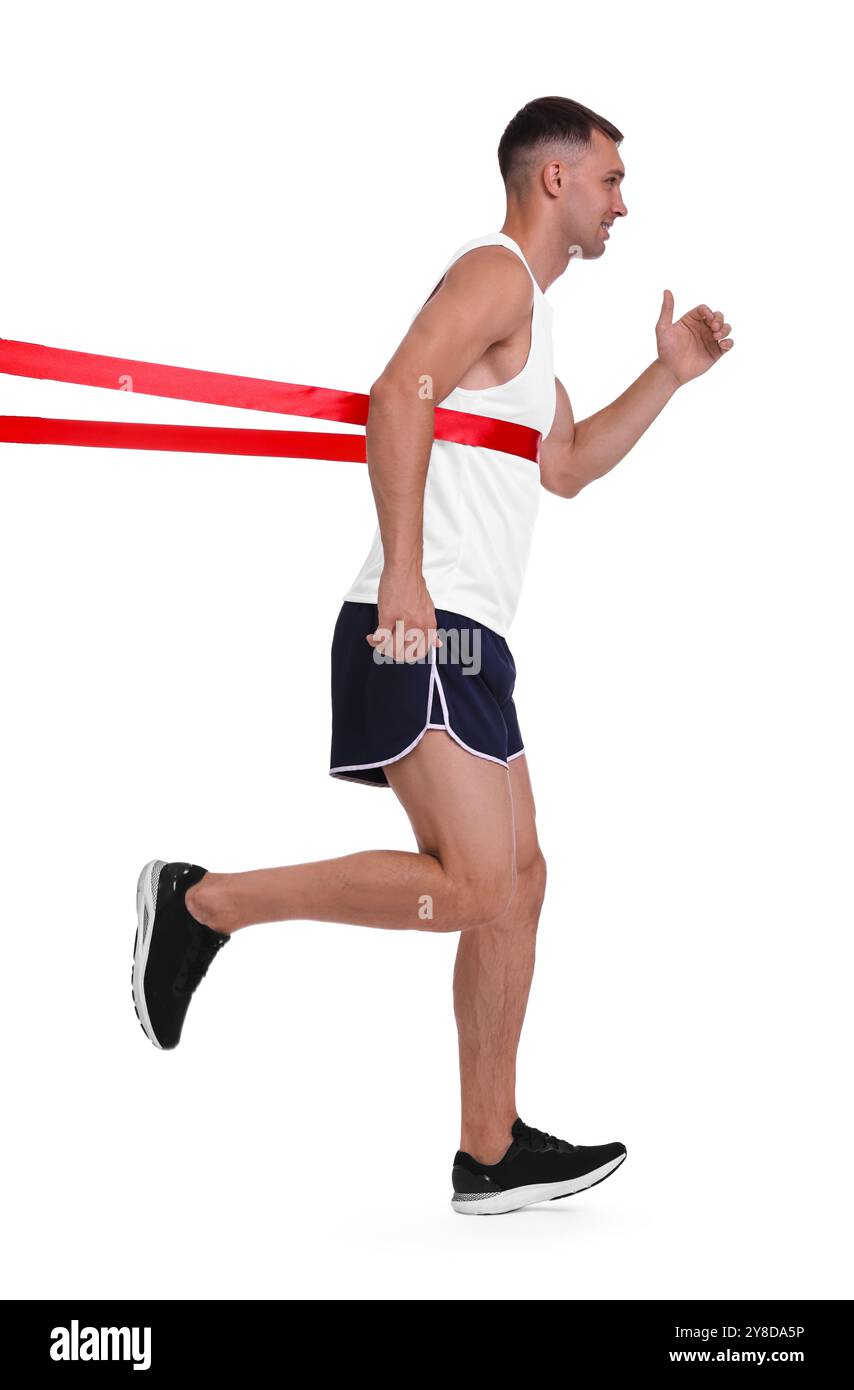 Man in sportswear crossing red finish line on white background Stock ...