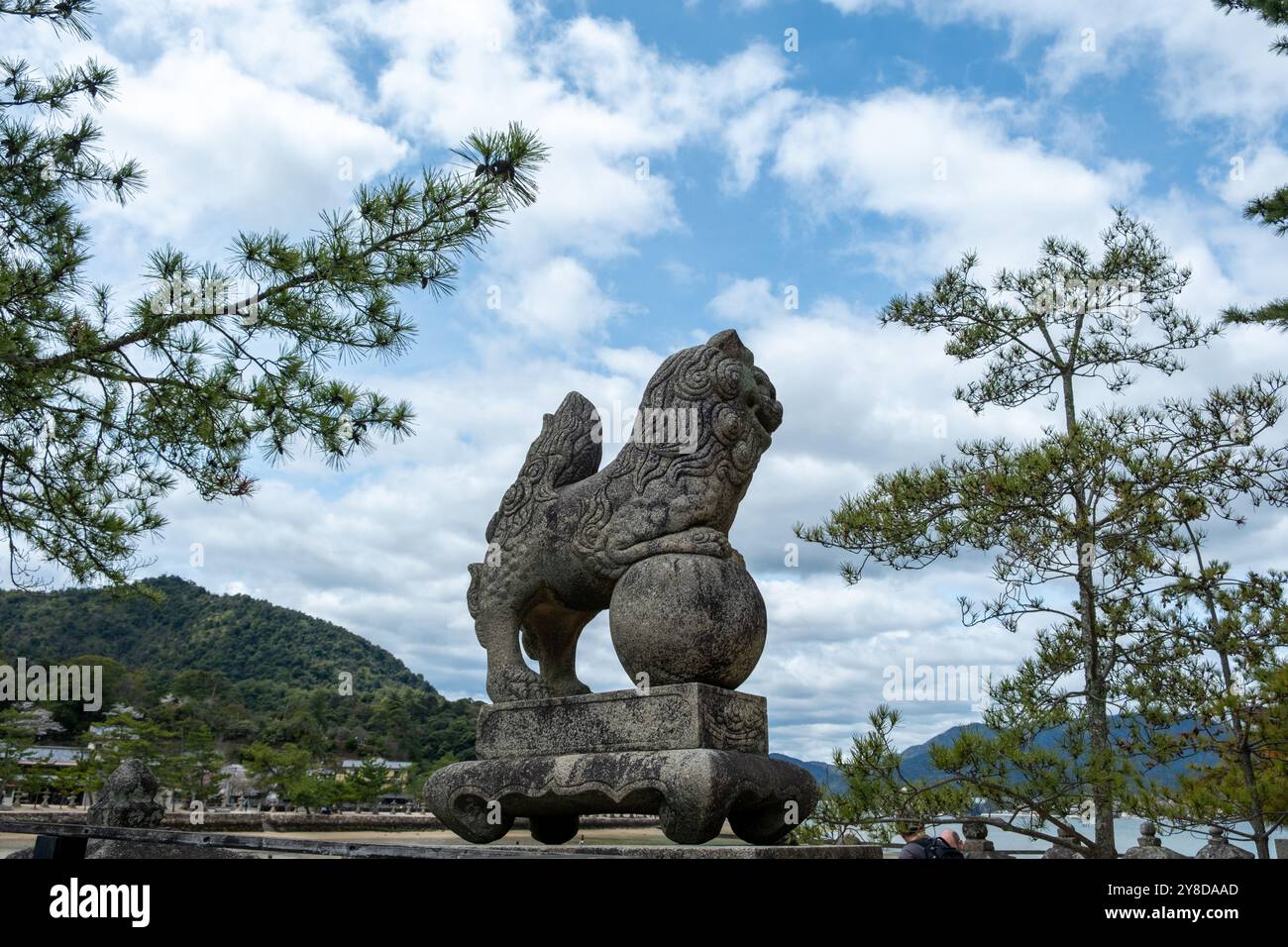 Komainu, a traditional Japanese lion dog statue at Itsukushima Shrine ...