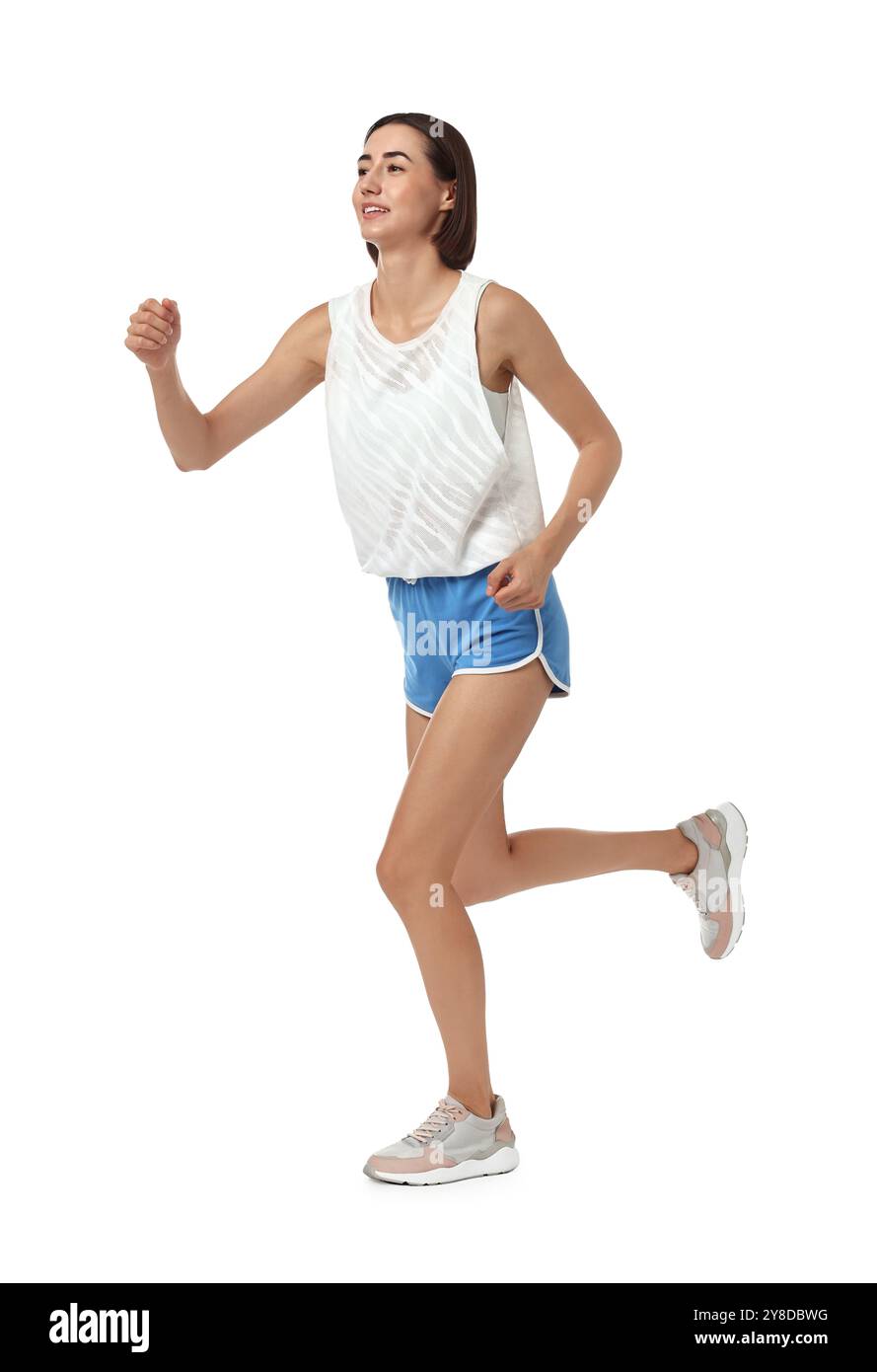 Beautiful young woman running on white background Stock Photo - Alamy