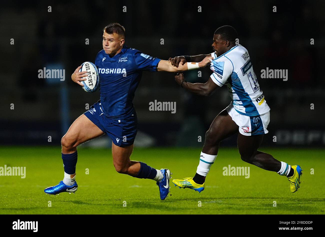 Sale Sharks' Joseph Carpenter (left) is tackled by Gloucester's ...
