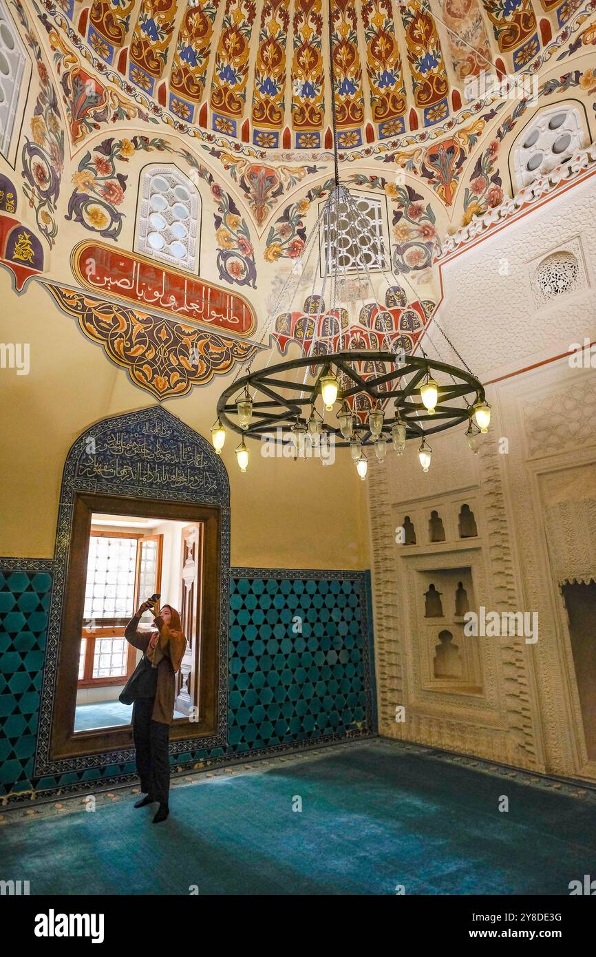 Bursa, Turkey - September 8, 2024: A woman visiting in the Green Mosque ...