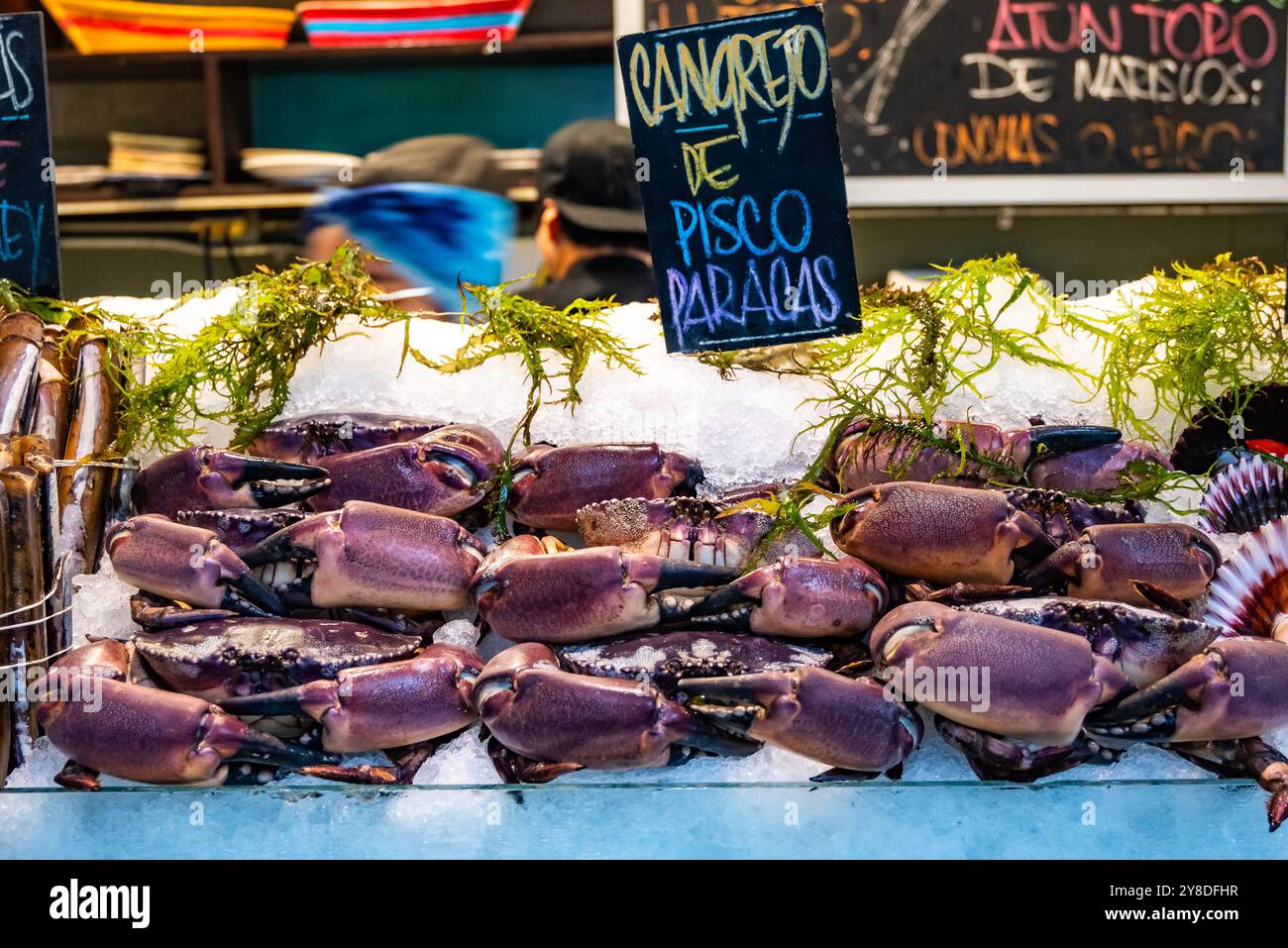 Fresh crabs and seafood displayed at the counter of a restaurant. Lima ...